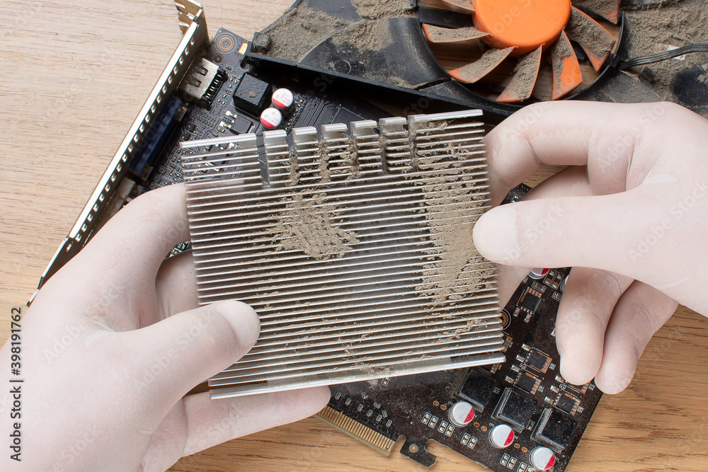 Repair of a modern computer, cleaning the components of a video card ...