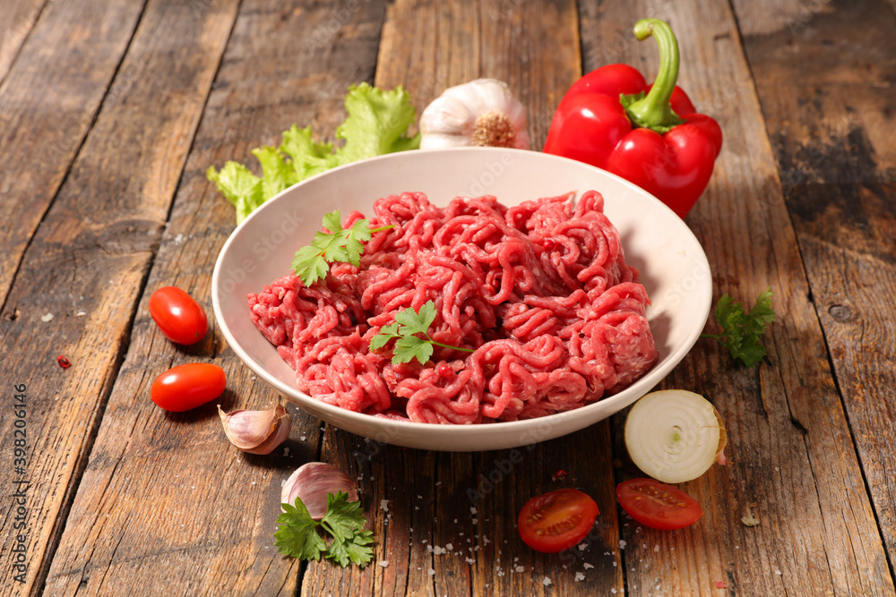 raw minced beef and spices Stock Photo | Adobe Stock
