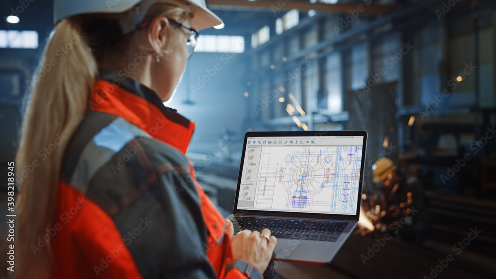 Professional Heavy Industry Engineer Uses Laptop Computer with CAD ...