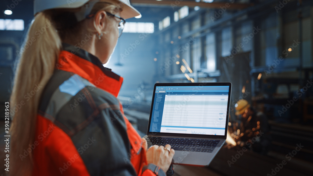 Professional Heavy Industry Engineer Uses Laptop Computer with ...