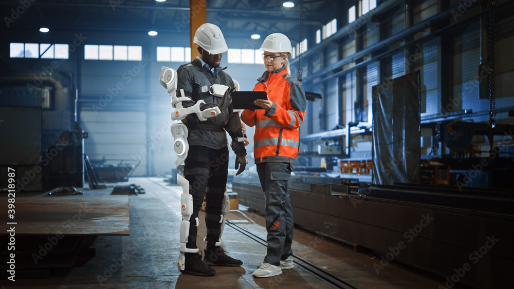Engineer and Manual Labor Worker in a Bionic Exoskeleton Prototype ...