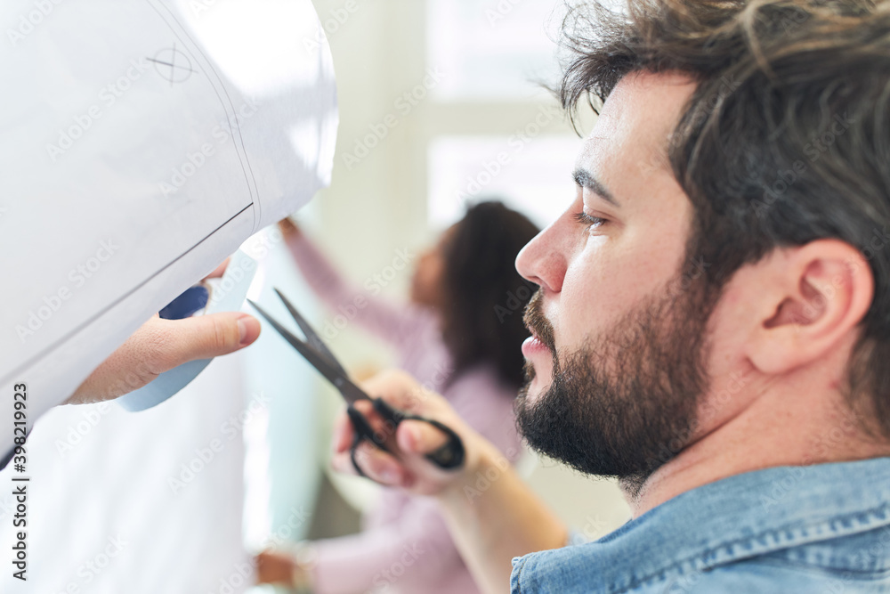 Students build a pin board together Stock Photo | Adobe Stock