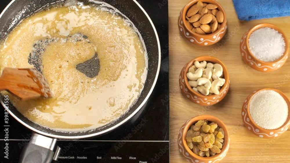 Frying Sooji/semolina in homemade Ghee to make delicious Halwa - food ...