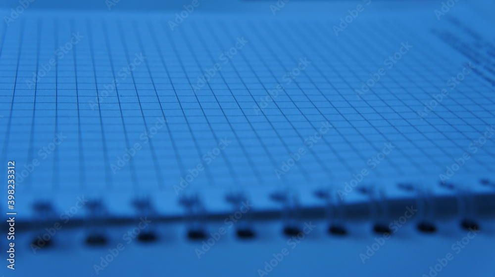 Checkered notepad, business background, copybook. Stock Photo | Adobe Stock