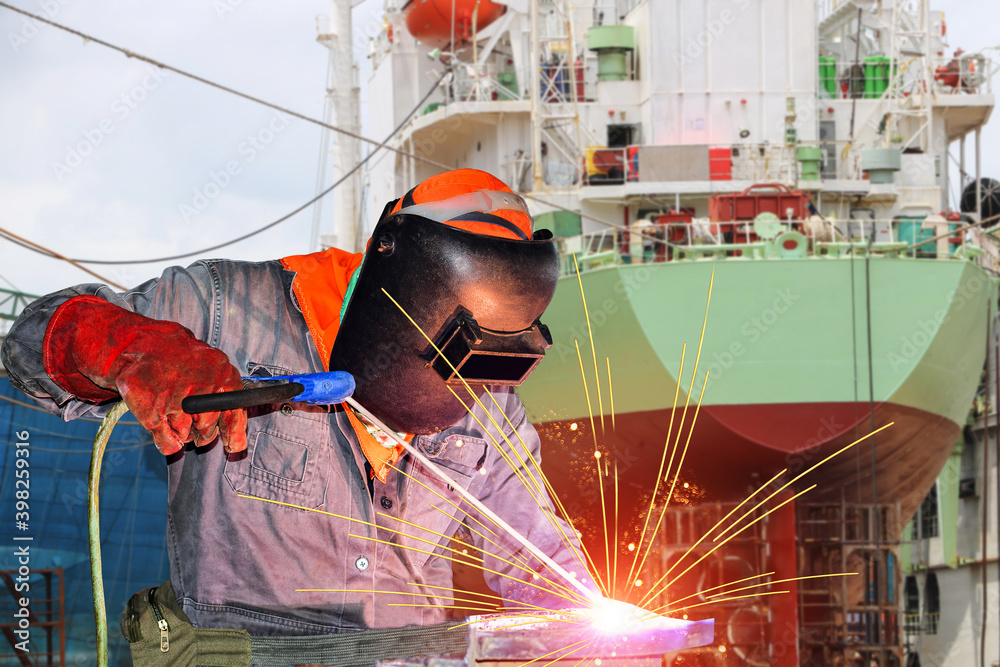Industry building ship, Welding worker with spark weld factory at ...