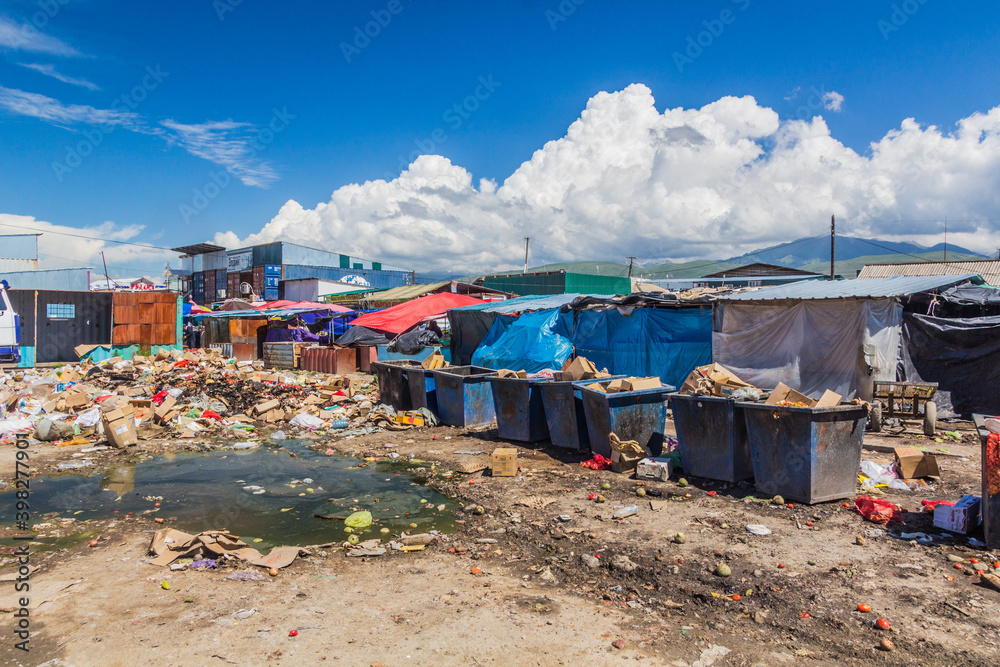 KARAKOL, KYRGYZSTAN - JULY 18, 2018: Rubish grounds at the bazaar in ...