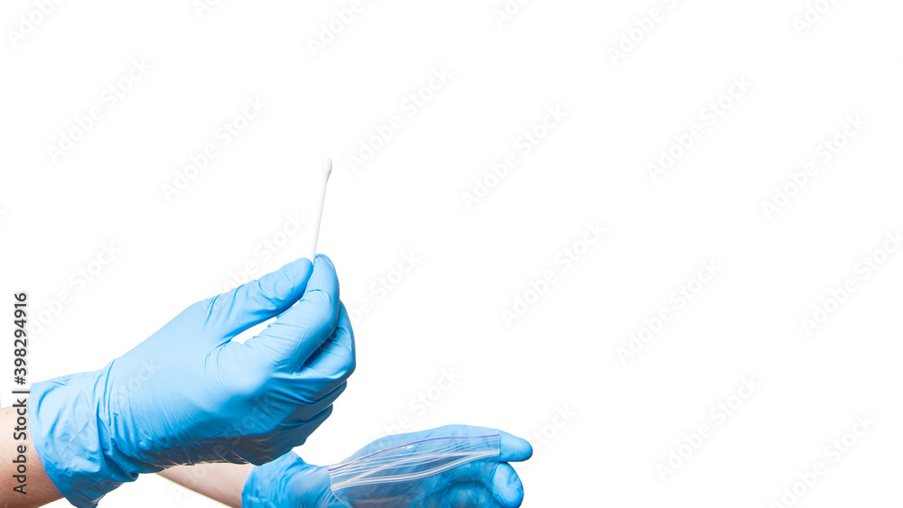 doctor hand in blue sterile glove holds sealed bag and give cotton swab ...