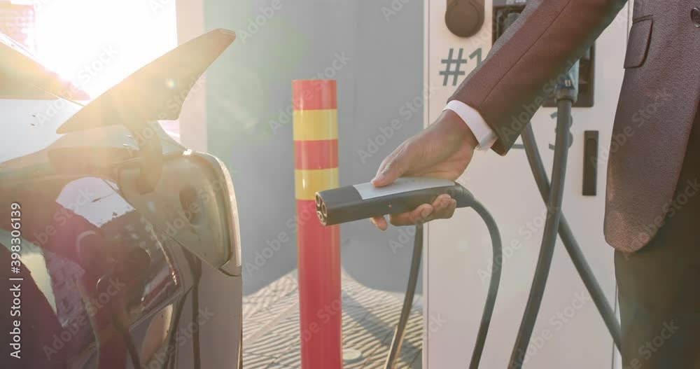 Start of a refueling process of an electric car. A shot under the hatch ...