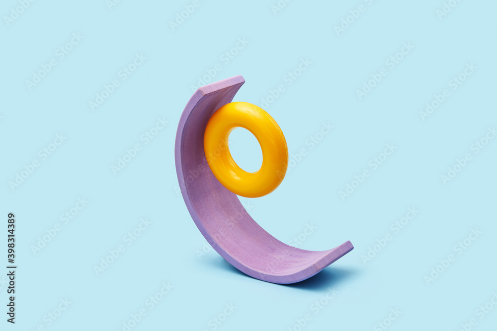 Balancing structure from wooden and plastic figures. Stock Photo ...