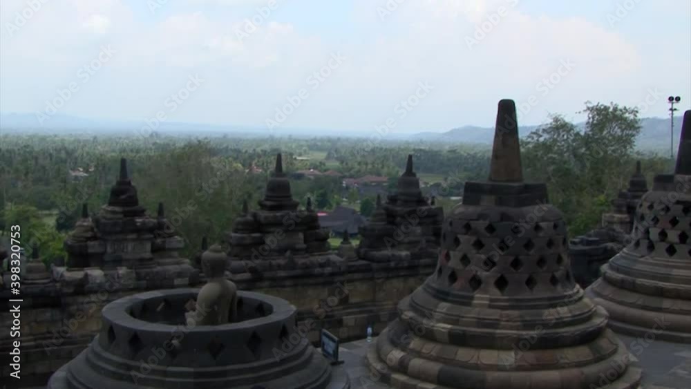 Buddha inside a stupa at Borobudur Temple, UNESCO World Heritage Site ...
