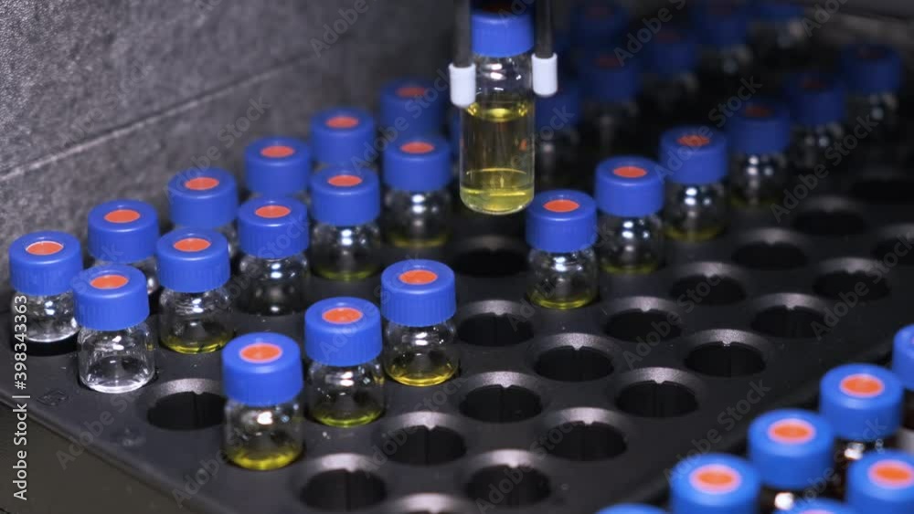 Auto sampler of HPLC in process. Testing of medical samples. Stock ...