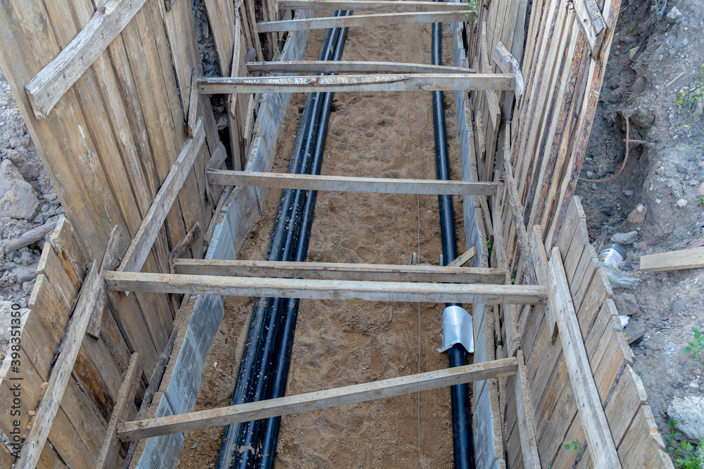 Trench with electrical cables. Laying the cable underground Stock Photo ...