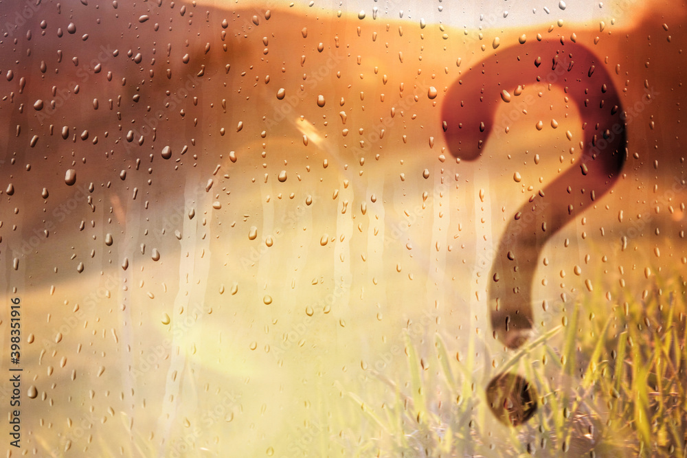 Autumn rain. Question mark symbol on sweaty glass with red light on ...