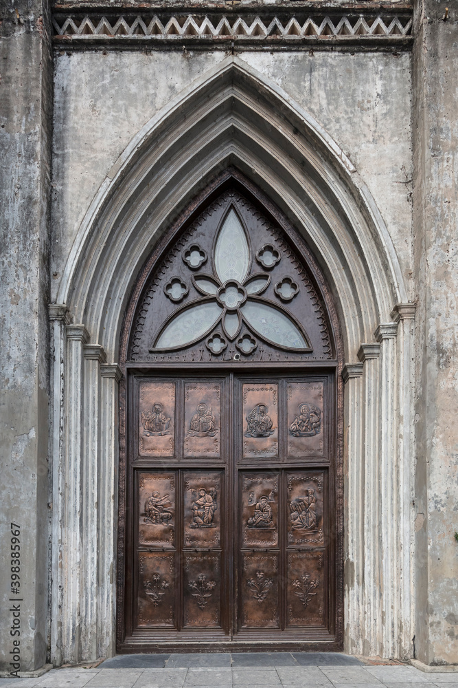 Brass door with bas reliefs captured at St Joseph's cathedral in the ...