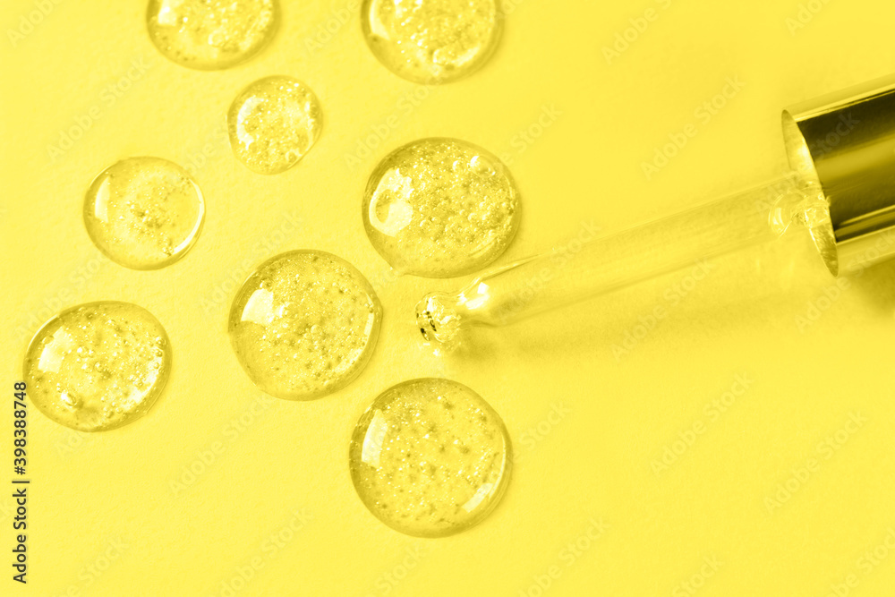 Pipette and drops and smears of cosmetics. Liquid gel or a drop of ...