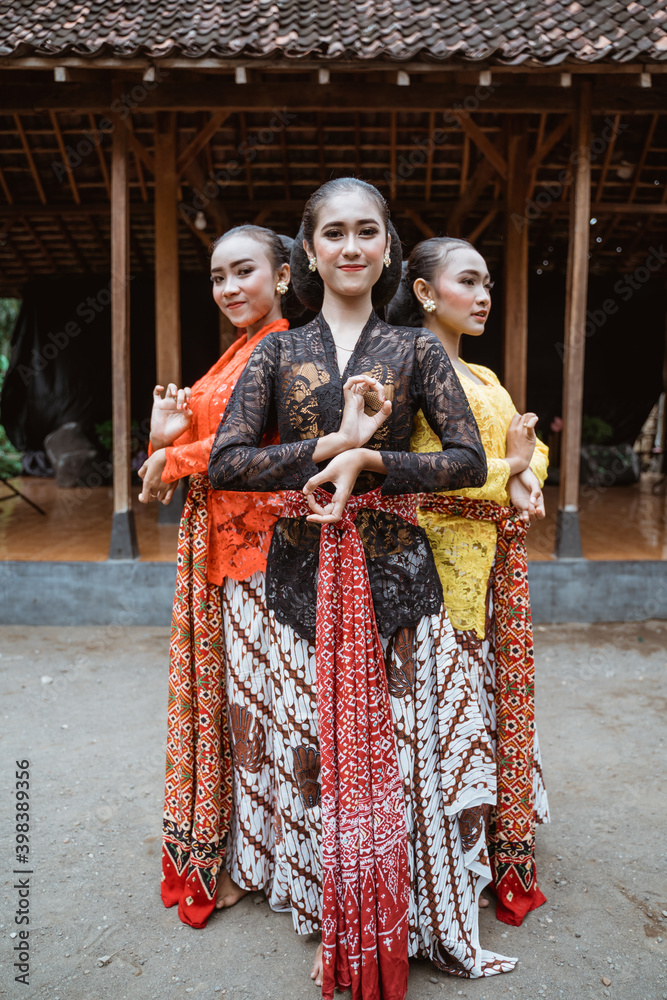 portrait of a young woman wearing Javanese kebaya traditional clothes ...