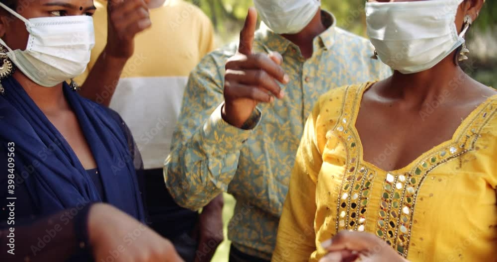 Slow-motion tilt up to close-up of faces of 4 friends, females and ...
