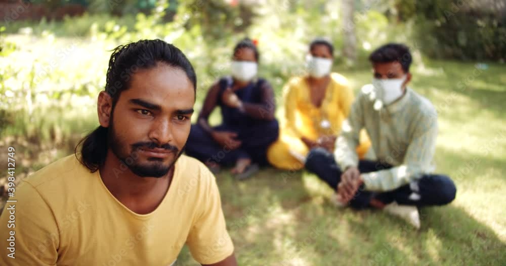 Slow-motion static shot of a young male smiling without mask ...