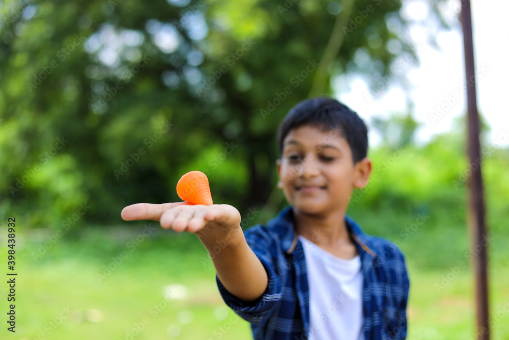 Cute indian little child playing Lattu, Bhovra or Bambaram is a ...