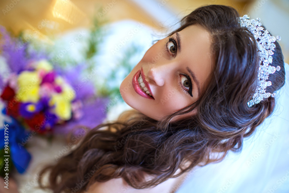 Beautiful young bride with wedding makeup and hairstyle with crown in ...