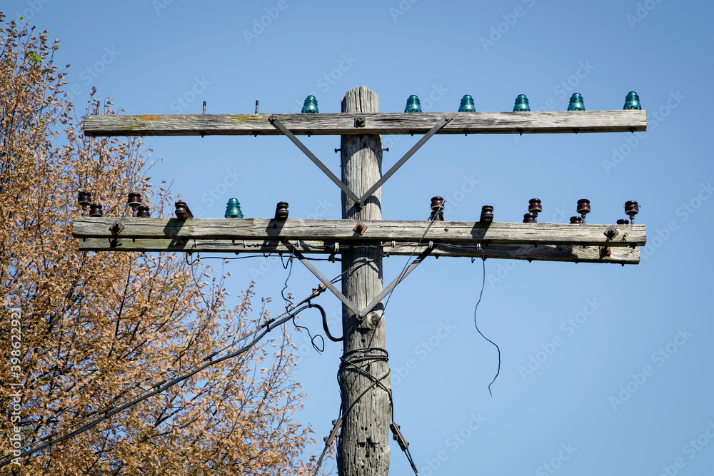 Old Telephone Pole with Glass Insulators against a Blue Sky Stock Photo ...
