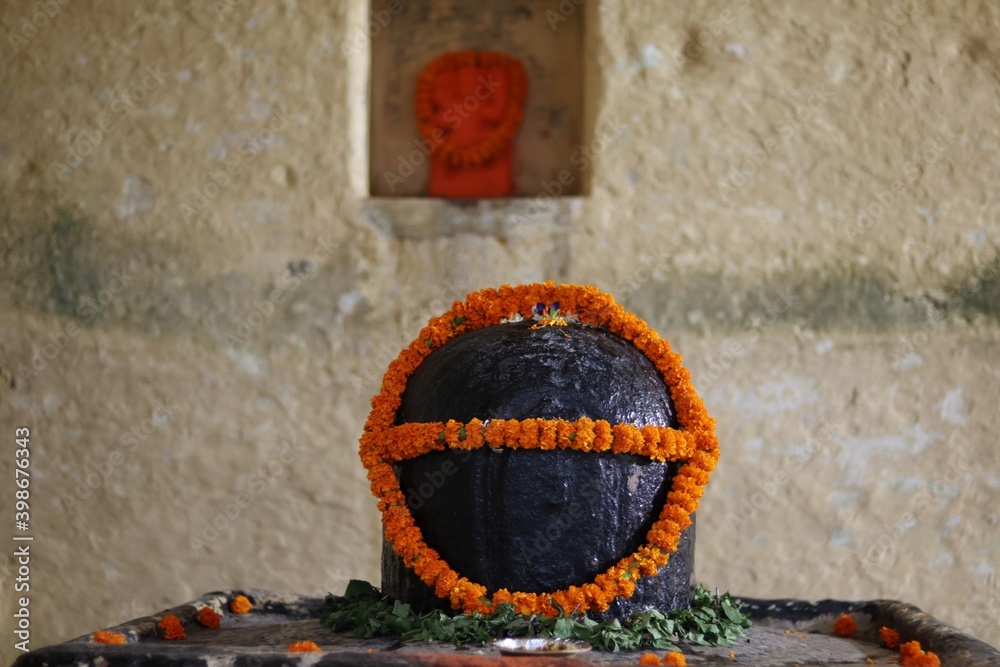 Shiva Lingam of Lord Shiva (Indian God) decorated with garlands and ...