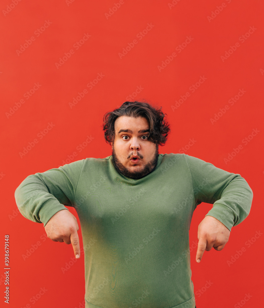 Vertical shot of a funny obese hispanic guy with a stylish haircut ...