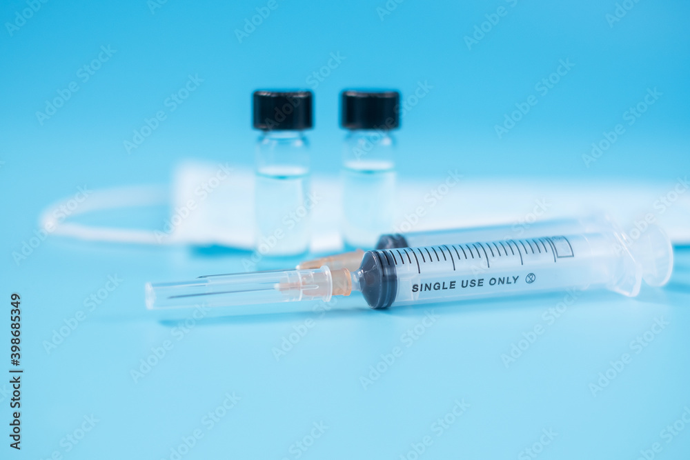 Vaccine vial dose with shot drug needle syringe in hospital laboratory ...