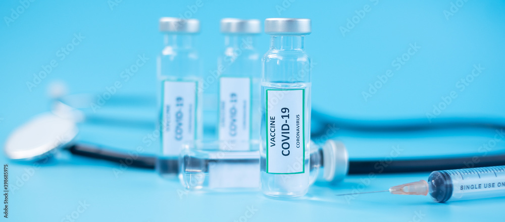 COVID-19 Vaccine vial, injection Needle Syringe and Stethoscope against ...