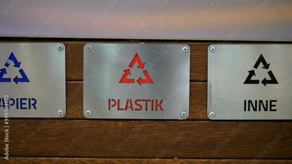 Garbage bin in public place with waste separation signs as sustainable ...