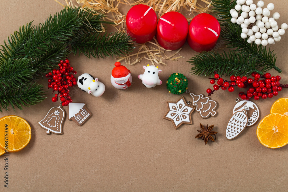Christmas objects on a cardboard background. Toy figures, spruce twigs ...