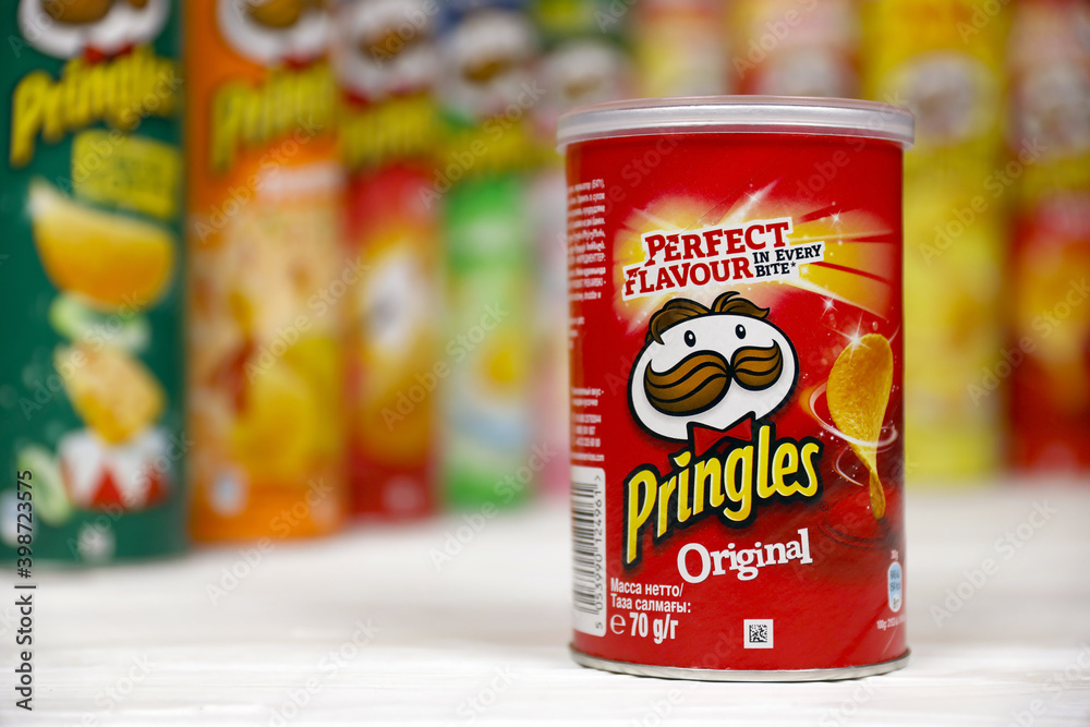 Pringles variety of flavors. Many cardboard tube cans with Pringles ...