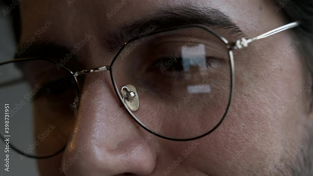 Vidéo Stock Close up macro view of young man in glasses eye moving fast ...