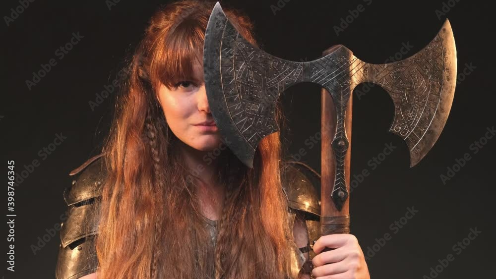 Strong and furious female valkyrie from the north with long brown hairs ...