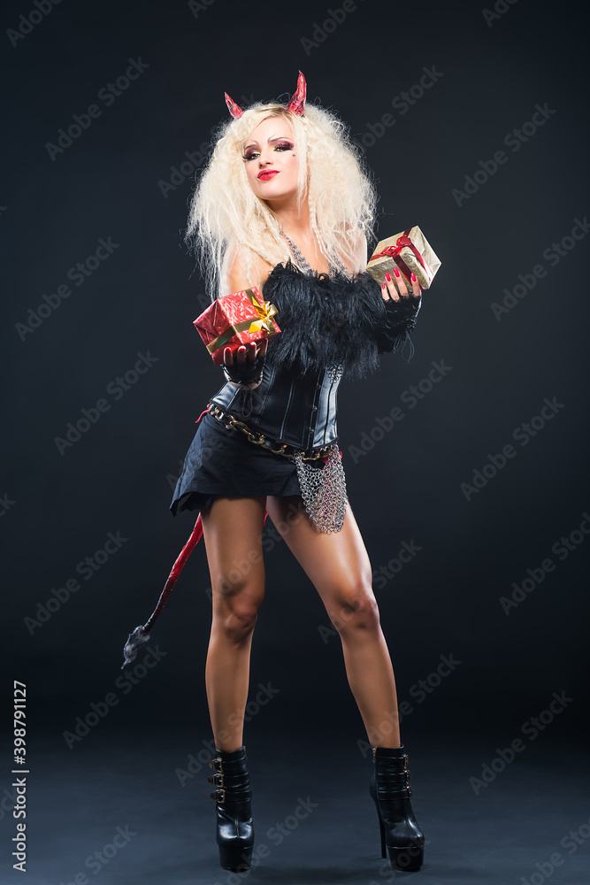Which One? Beautiful Devil girl offering two Christmas presents to ...
