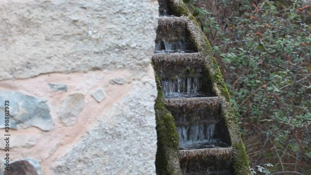 Vidéo Stock Cinemagraph effect of water in the wheel of ancient water ...