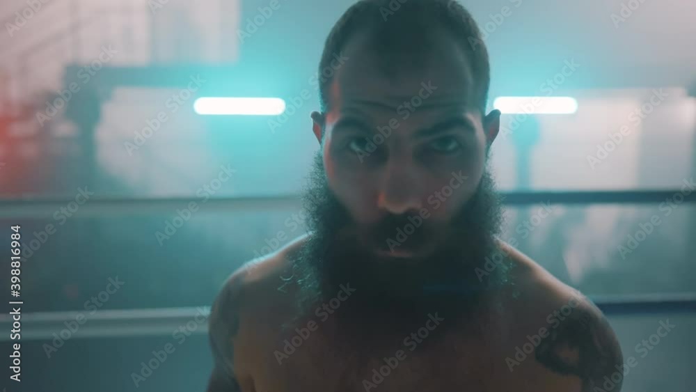 Boxer in the boxing gym. Bandages his hands. Sparring in the ring ...