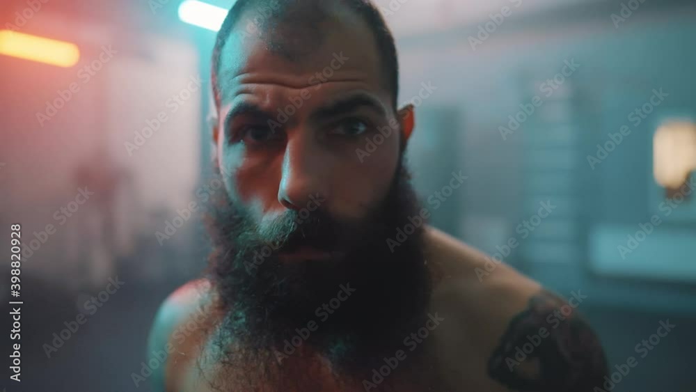 Boxer in the boxing gym. Bandages his hands. Sparring in the ring ...