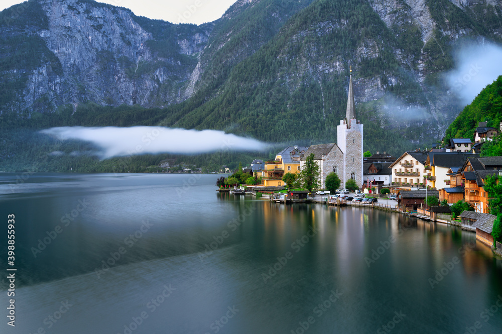 Scenic picture-postcard view of famous Hallstatt mountain village in ...
