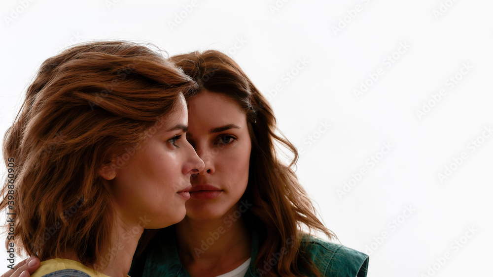 Front And Side View Of Two Attractive Young Girls Twin Sisters Posing