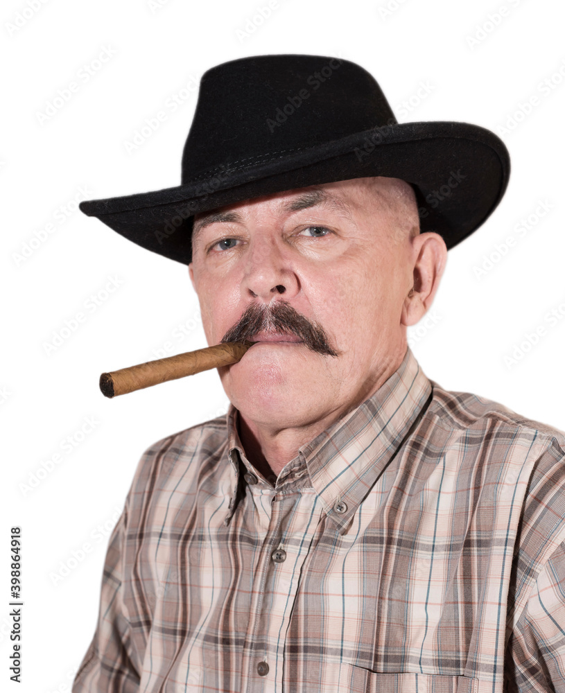 The cowboy with mustache, in a black hat smoking a cigar Stock Photo ...
