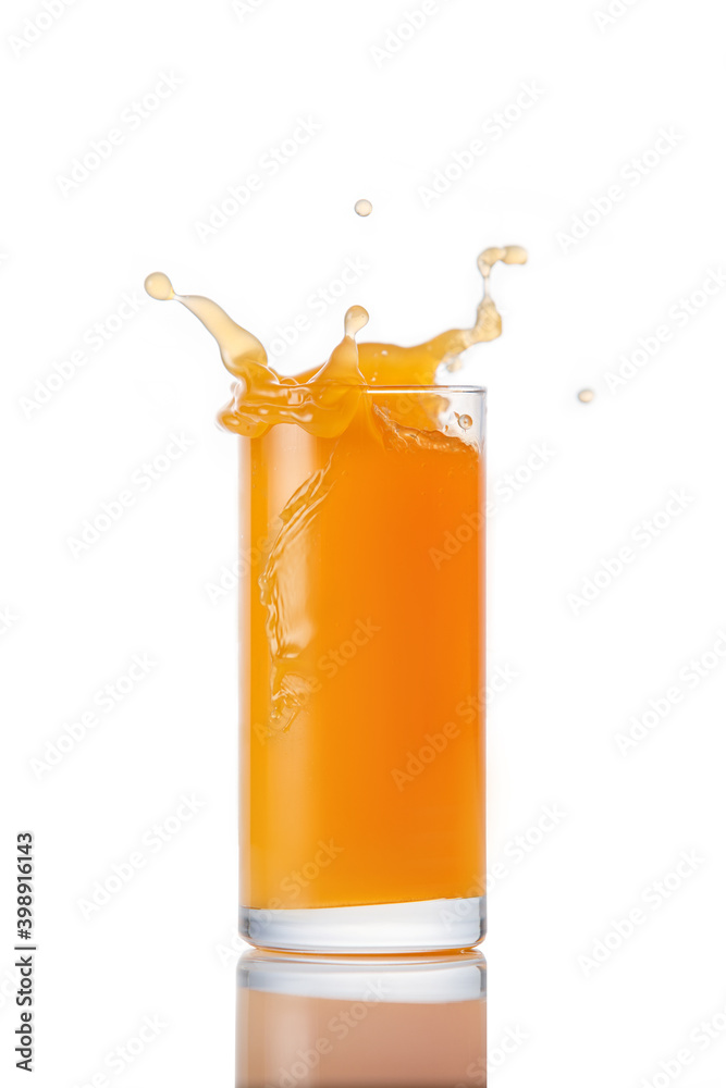 The glass of splashing fruit juice isolated on white background. Stock ...