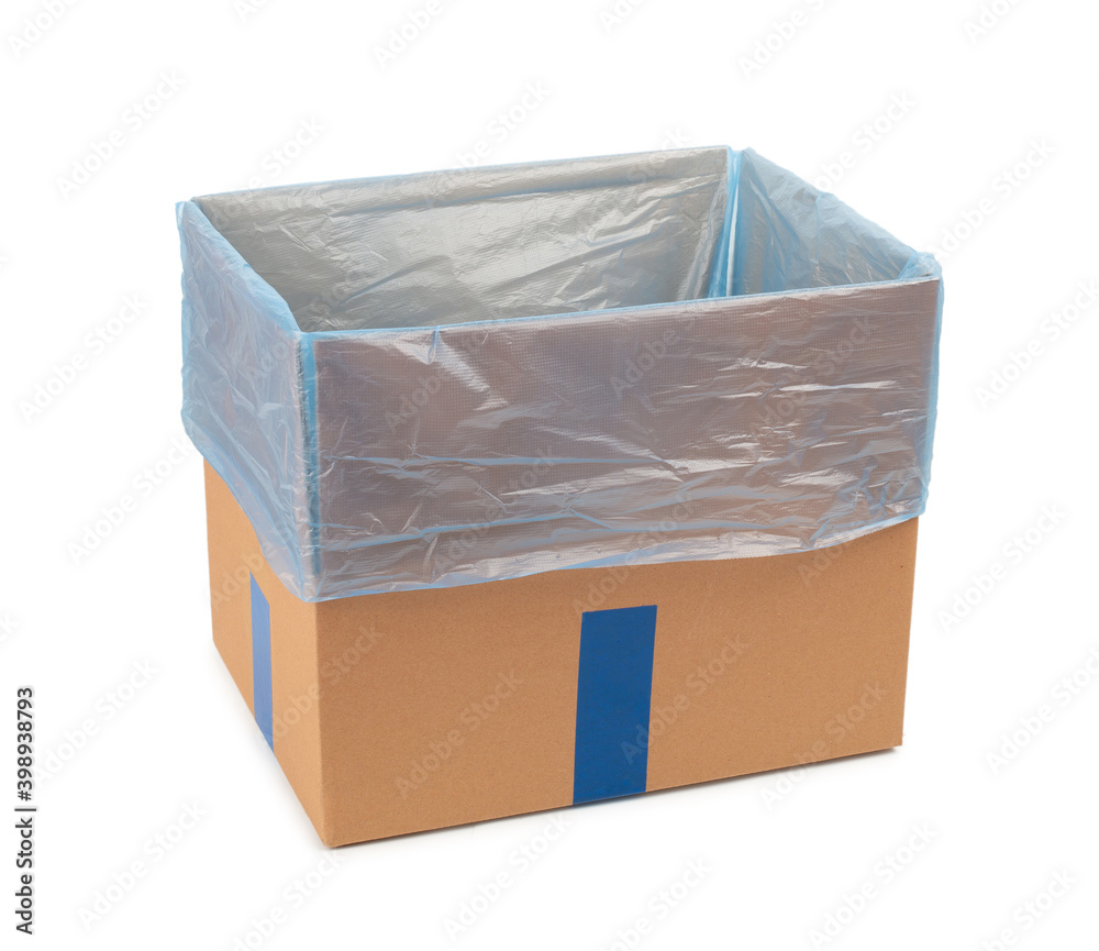 Opened cardboard box with a plastic bag inside. Isolated on white ...