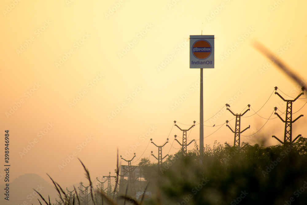 Signage of indian oil petrol pump shot against a monsoon clouds and ... Signage of indian oil petrol pump shot against a monsoon clouds and ...