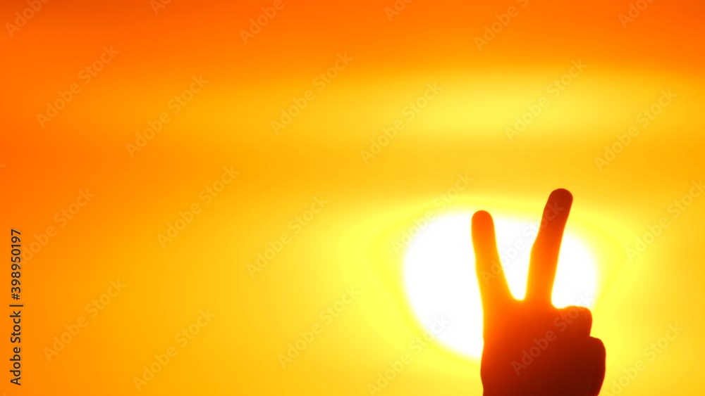 Two fingers up in the peace or victory symbol. Gesture Victory or Peace ...