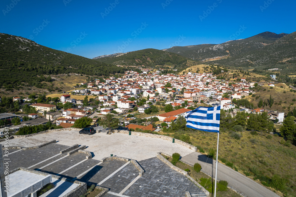 Distomo Massacre Memorial . Village of Distomo. Sunny day blue sky with ...