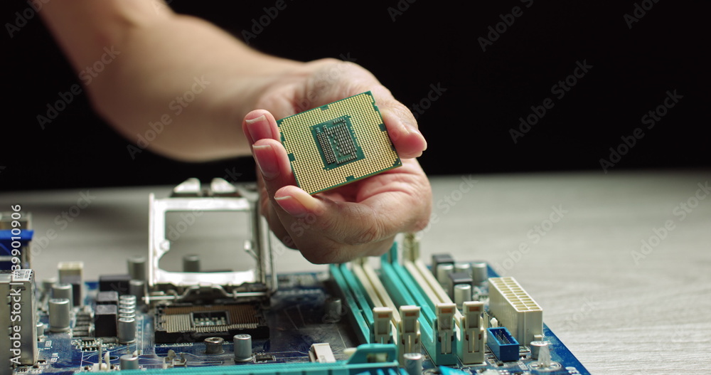 A gloved holds a processor. Close-up Presentation of a New Generation ...