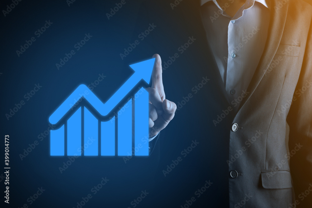 Businessman man holding a graph with positive profits growth. plan ...