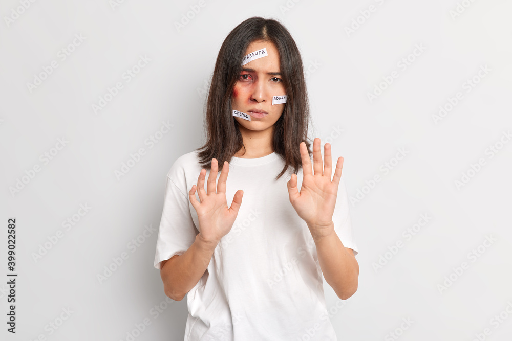 Dont touch me. Displeased abused Asian woman victim stretches out hands ...