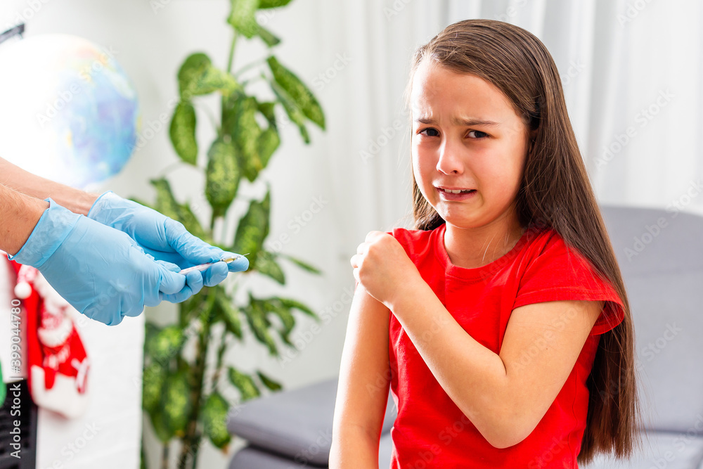 Doctor holds syringe to vaccinate sick baby with injection. Crying and ...